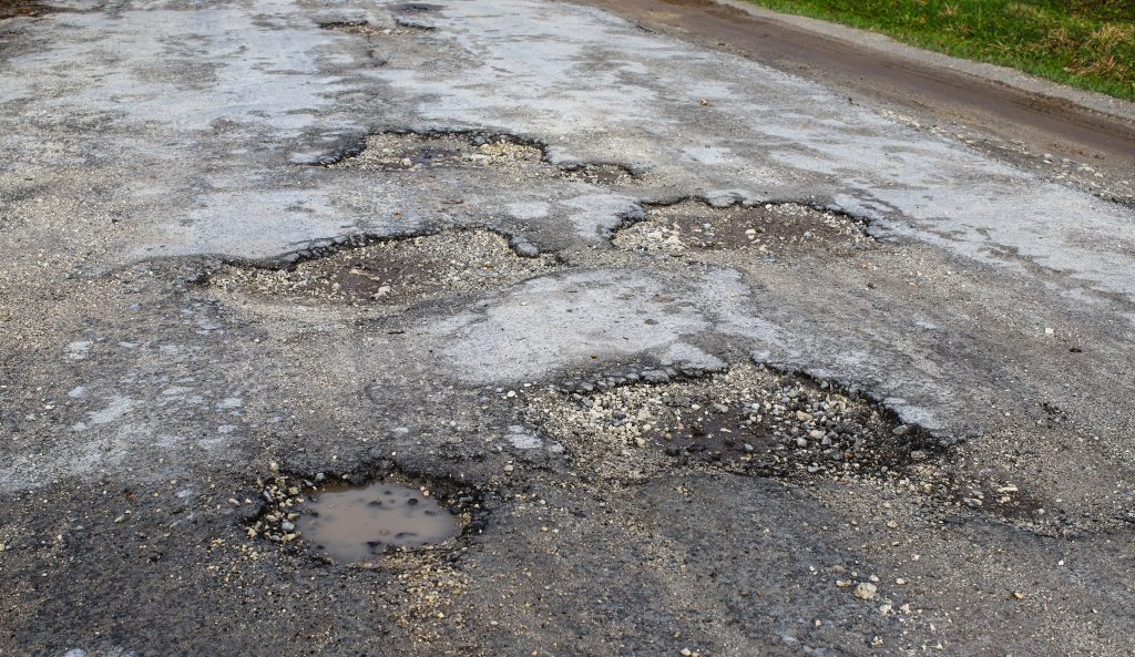 Tired of Dodging Potholes? Keep Your Pavement Smooth - M Wells Asphalt ...